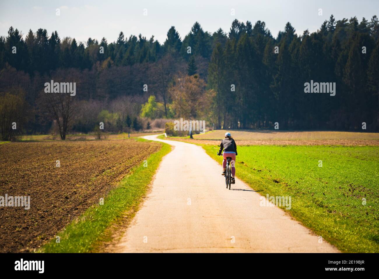 Woman leading bike hi-res stock photography and images - Alamy