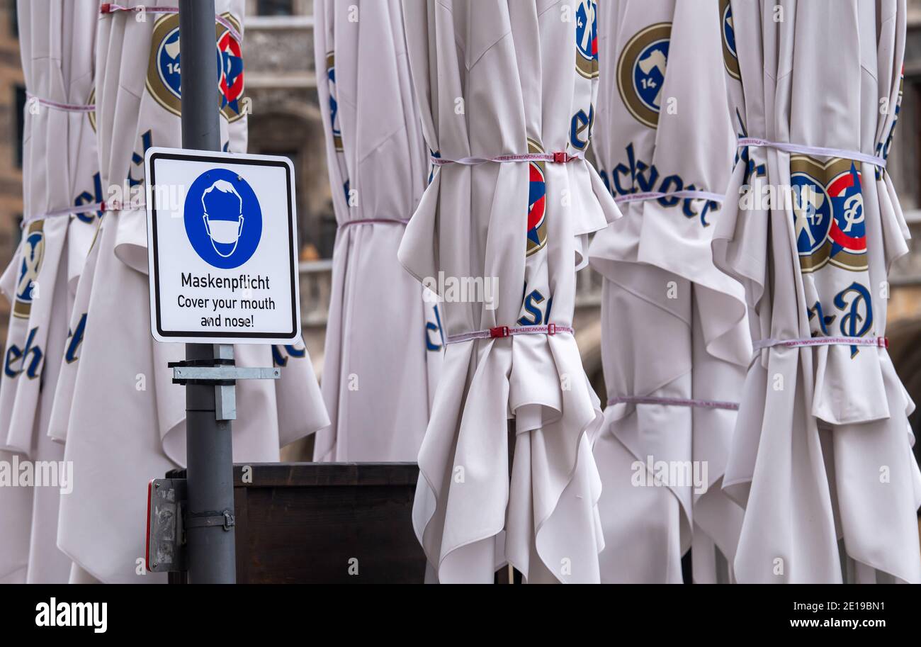 Munich, Germany. 05th Jan, 2021. A sign reading "Mandatory masks ...