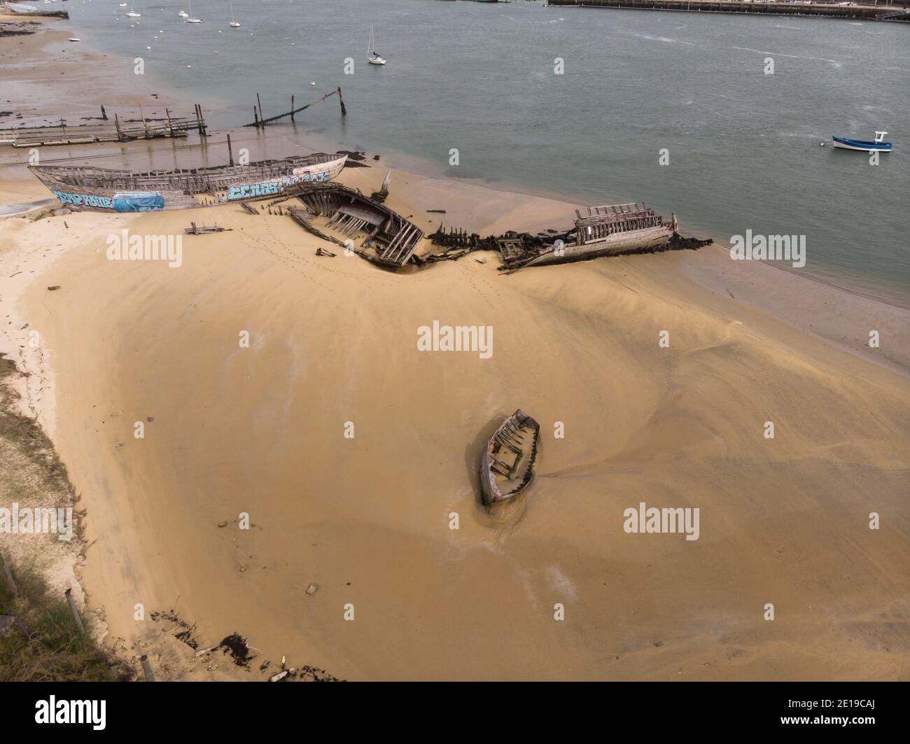 Aerial view of stranded broken wooden shipwrecks on fishing boat ship ...