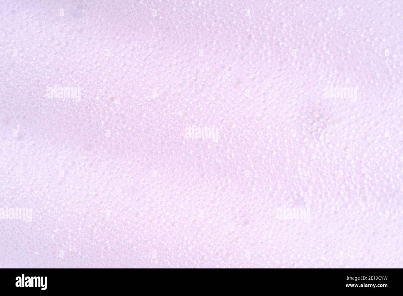 Purple laundry spume. Foam macro background with bubbles. Soapy surface ...