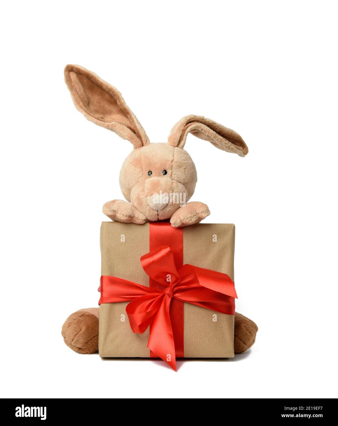 cute plush rabbit holding a gift box tied with a red silk ribbon, white ...