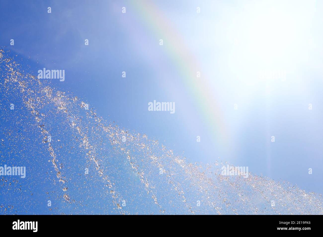 Water splashing in sunlight with rainbow Stock Photo - Alamy