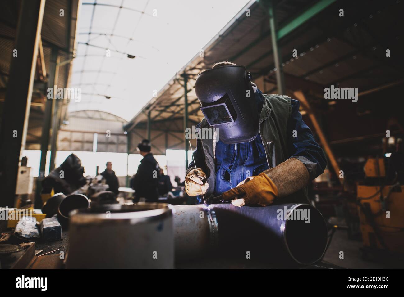 Man welding in uniform hi-res stock photography and images - Alamy