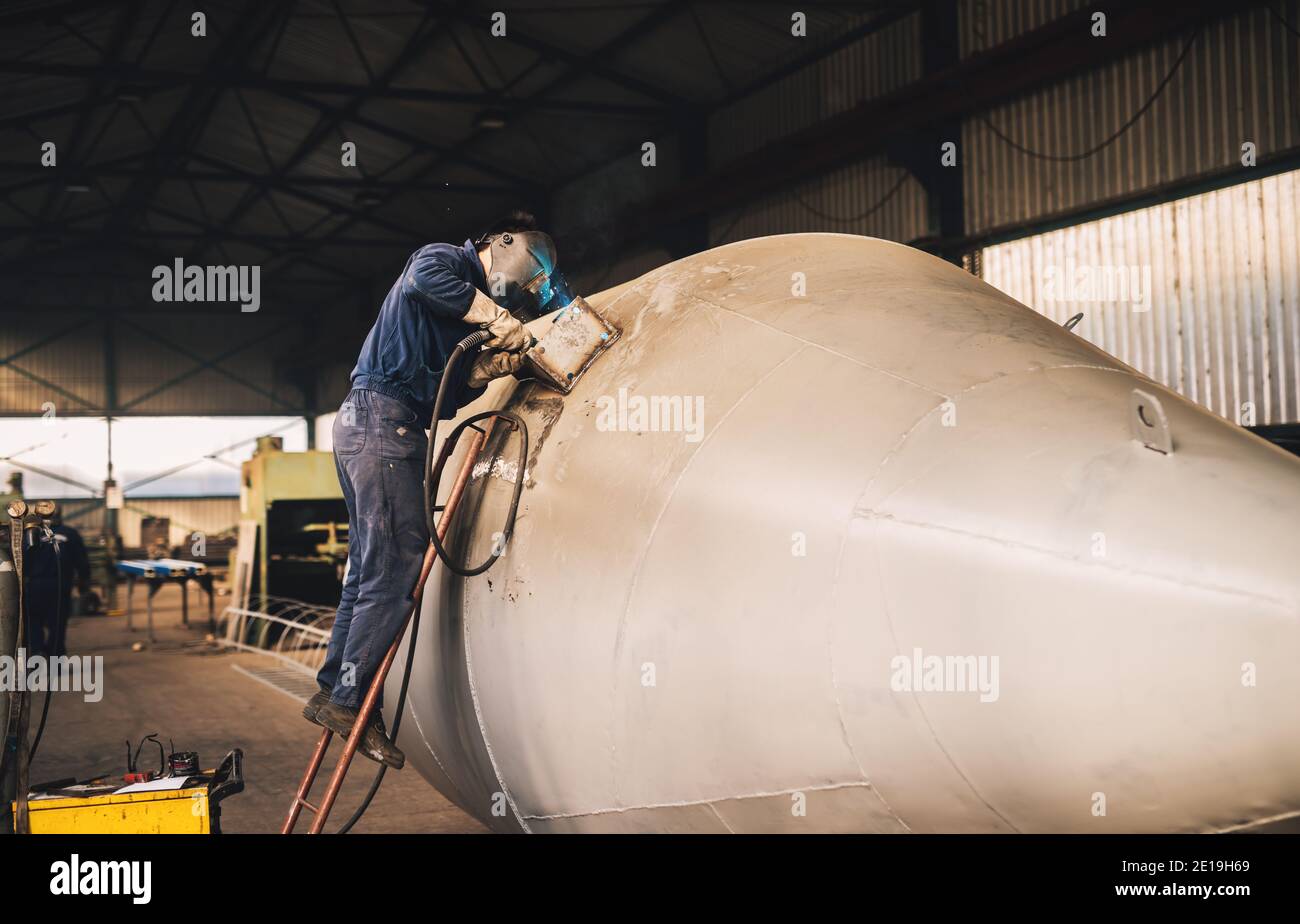 Man welding in uniform hi-res stock photography and images - Alamy