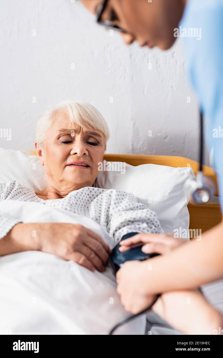 Asian nurse tonometer measuring senior hi-res stock photography and ...