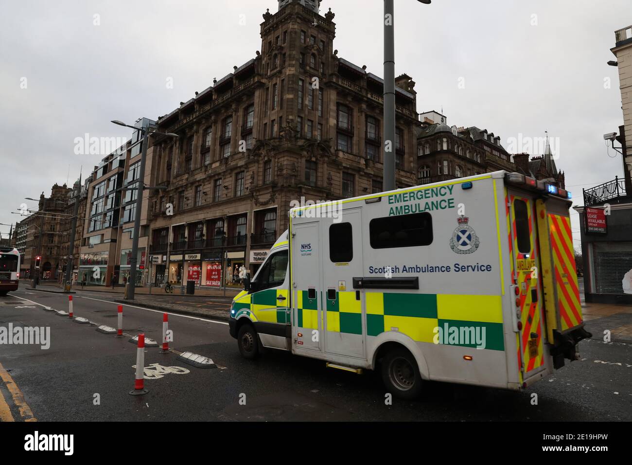 An ambulance drives along Prince Street, Edinburgh, where stricter ...
