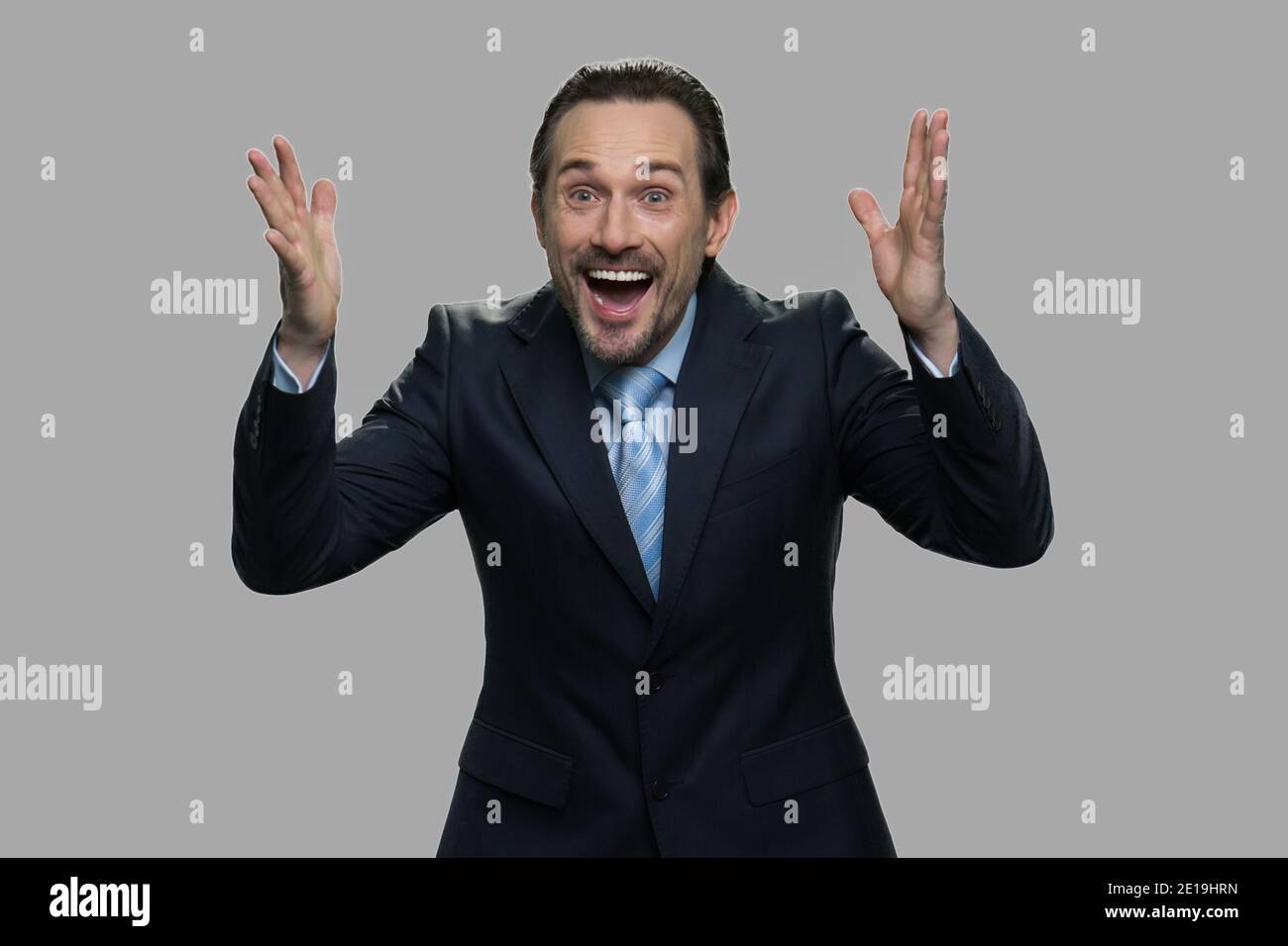 Overjoyed businessman expressing happiness Stock Photo - Alamy
