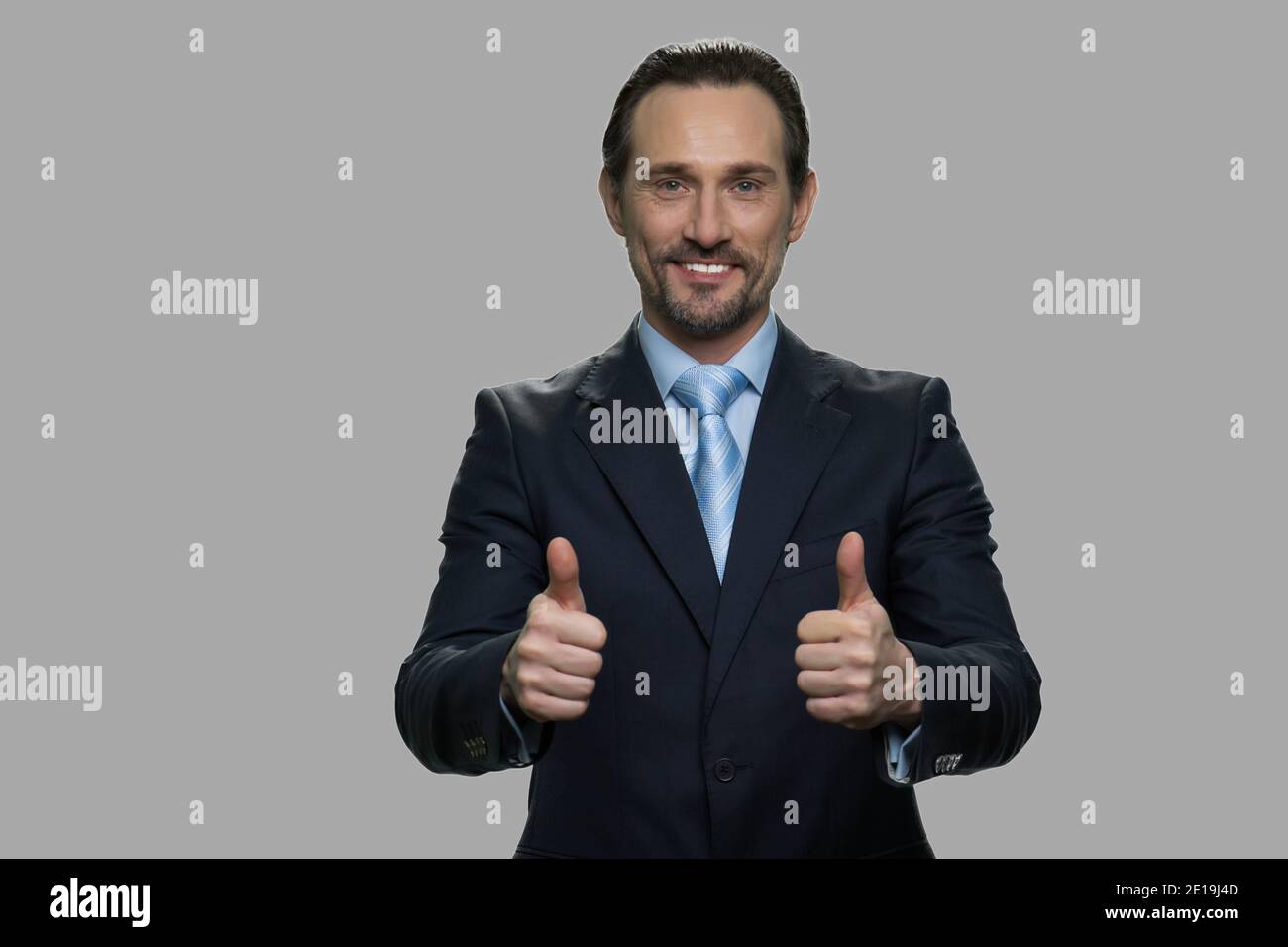 Middle aged businessman thumbs up hi-res stock photography and images ...