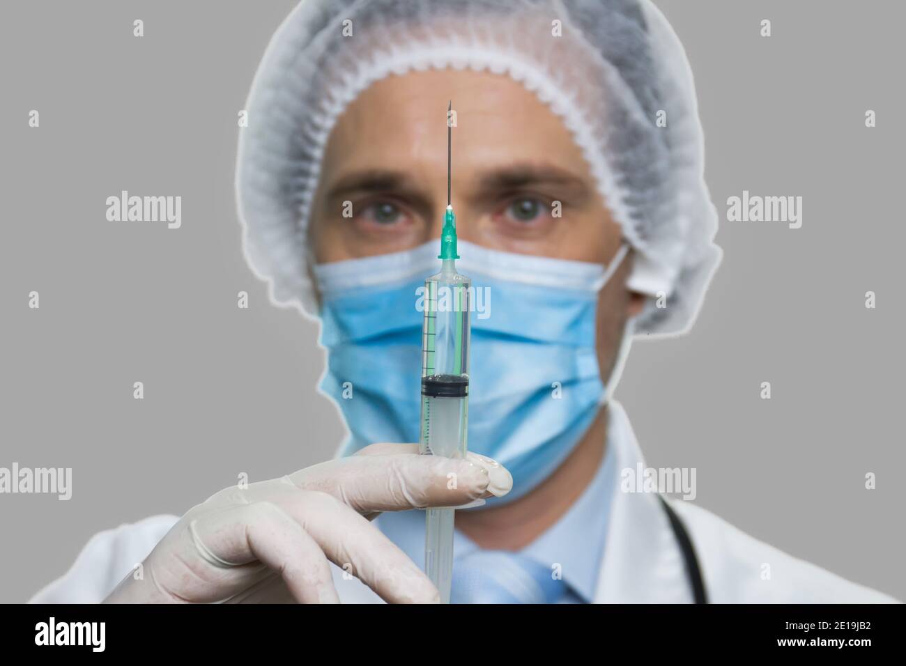 Close up doctor preparing syringe for injection Stock Photo - Alamy