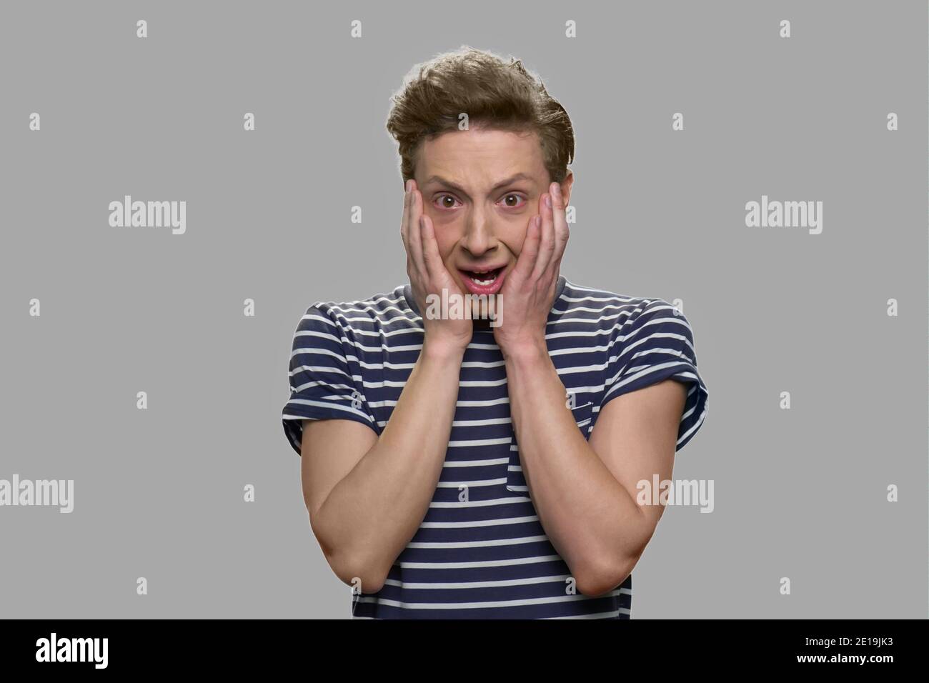 Close up shocked face of teenage boy Stock Photo - Alamy