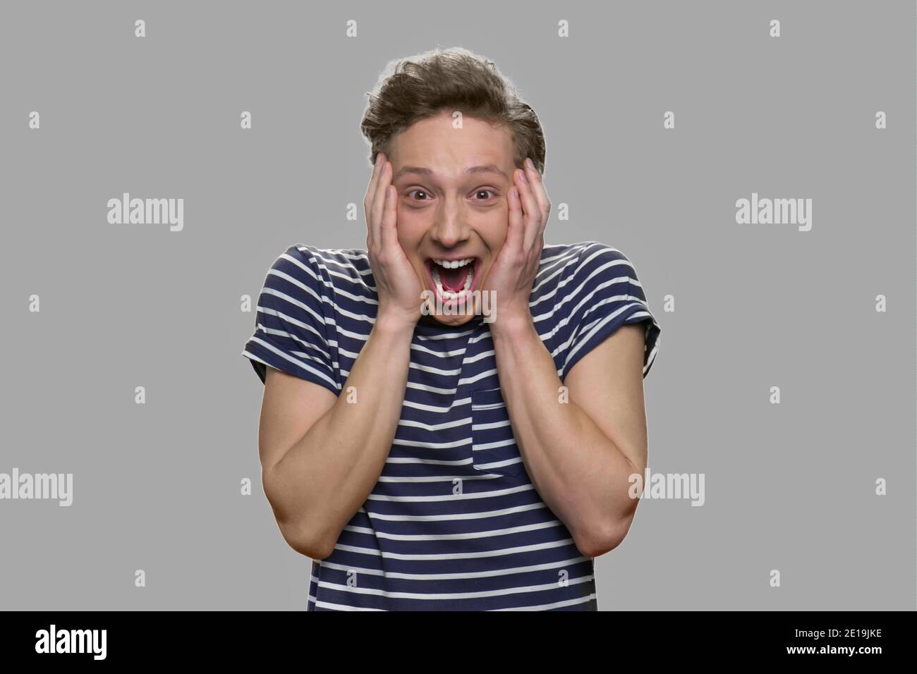 Happy shocked teen boy close up Stock Photo - Alamy