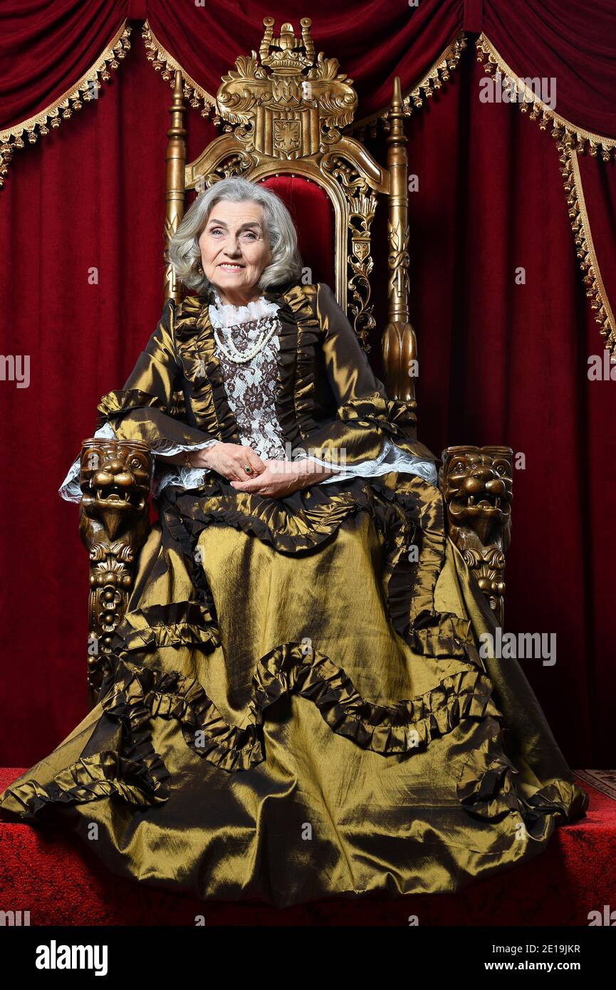 Portrait of beautiful senior woman Queen on throne Stock Photo - Alamy