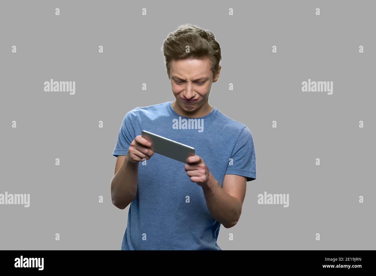 Boy playing game on mobile hi-res stock photography and images - Alamy