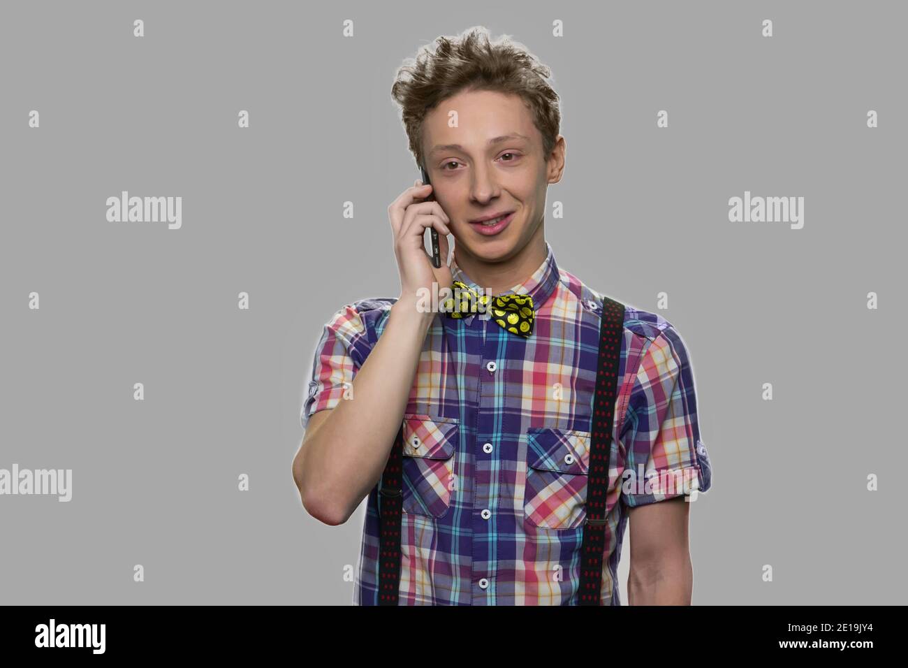 Teen boy talking on smartphone hi-res stock photography and images - Alamy