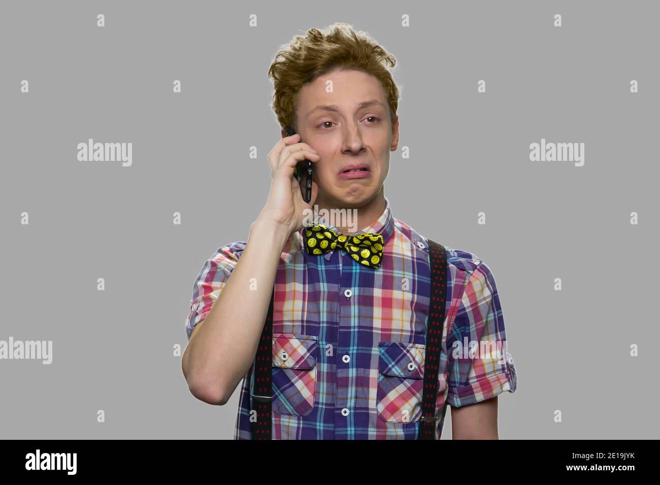 Teen boy talking on smartphone hi-res stock photography and images - Alamy