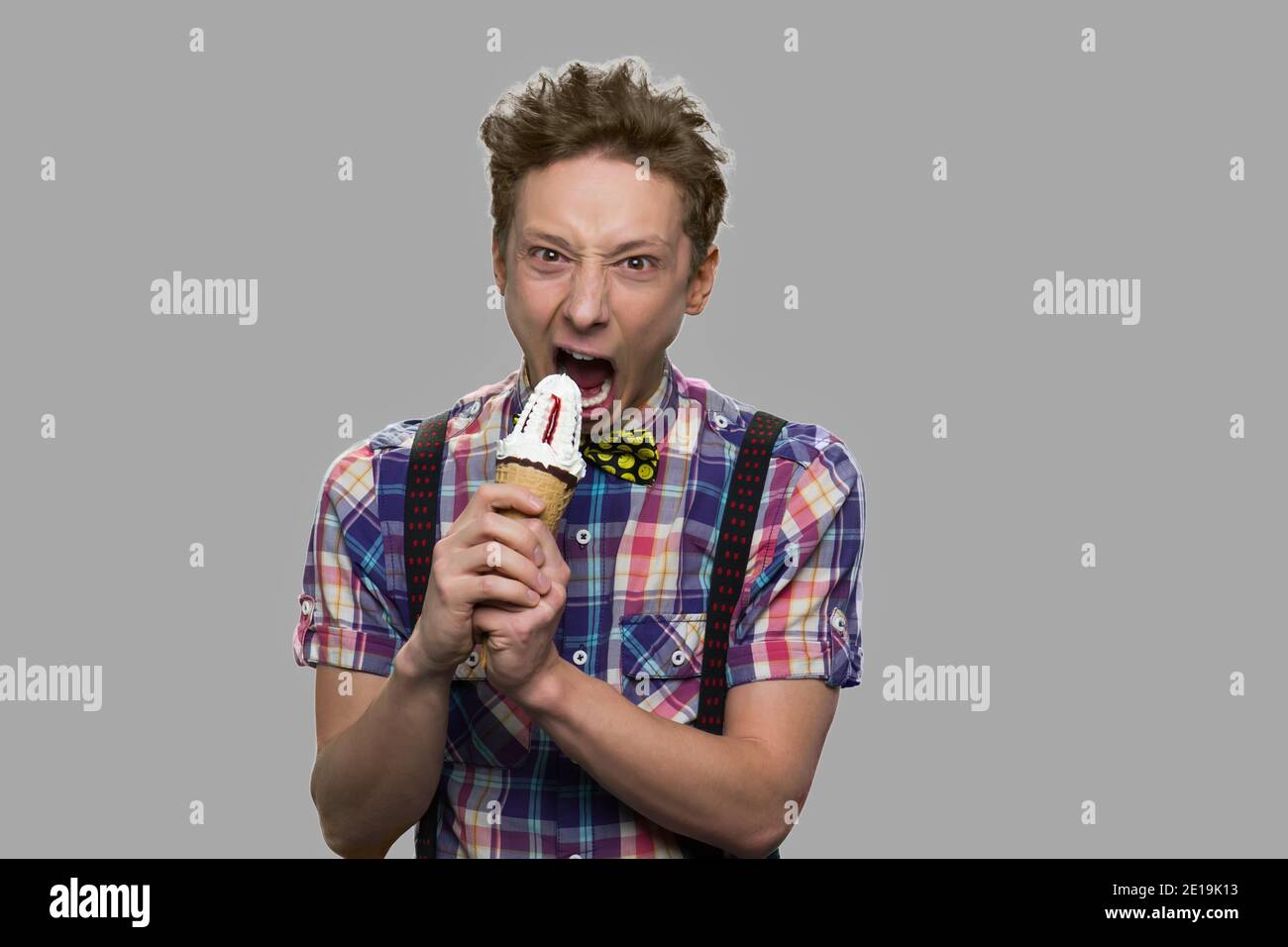Crazy teen boy eating ice cream Stock Photo - Alamy
