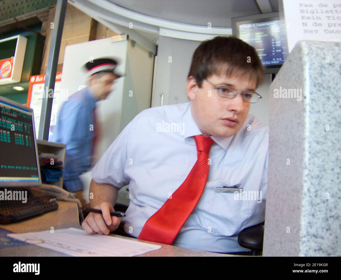 Train station help information desk and assistant Stock Photo - Alamy