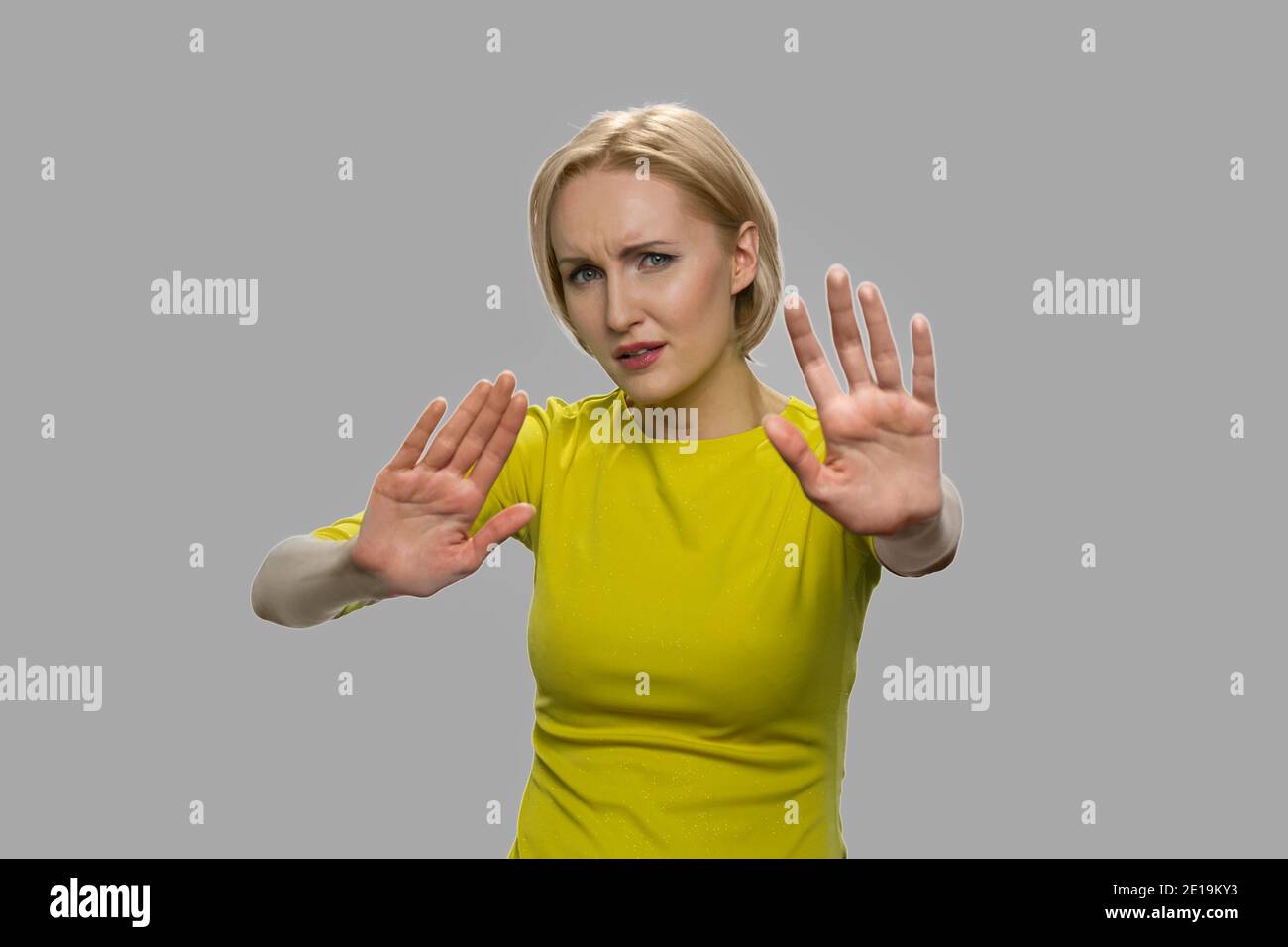 Young caucasian woman showing rejection sign Stock Photo - Alamy