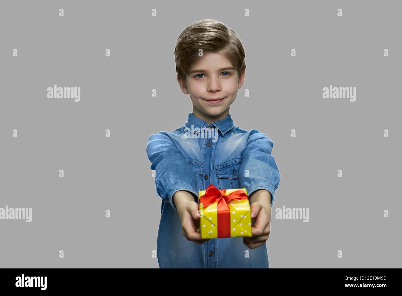 Child offering gift hi-res stock photography and images - Alamy