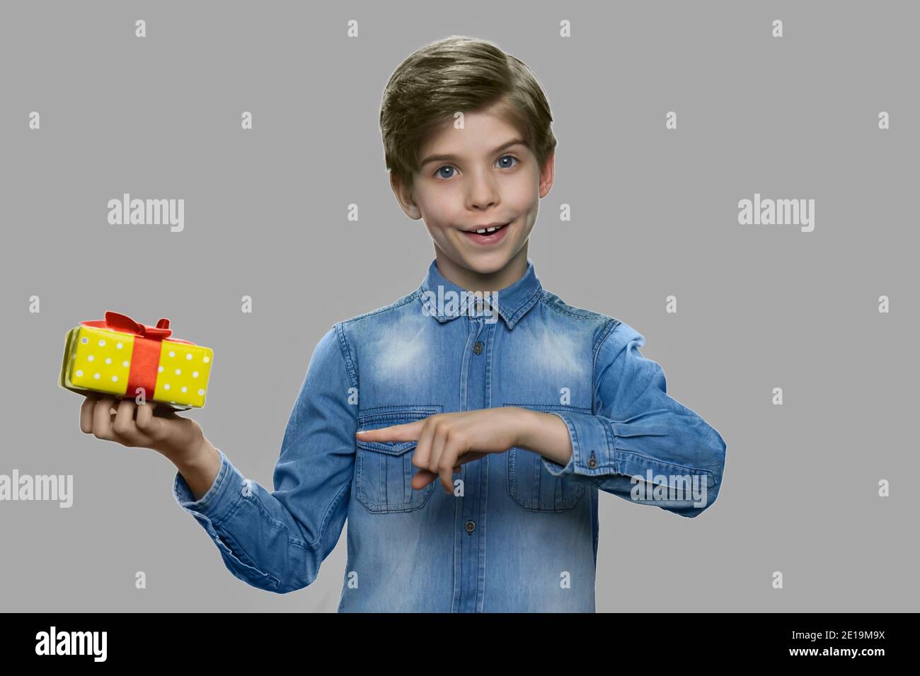 Cute smiling kid with gift box Stock Photo - Alamy