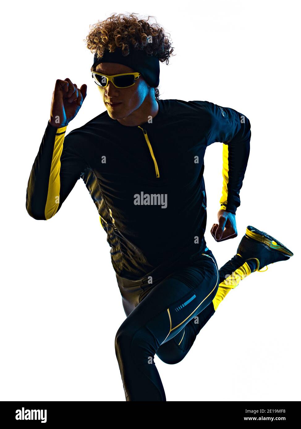one youg caucasian runner jogger running jogging man in studio shadow ...