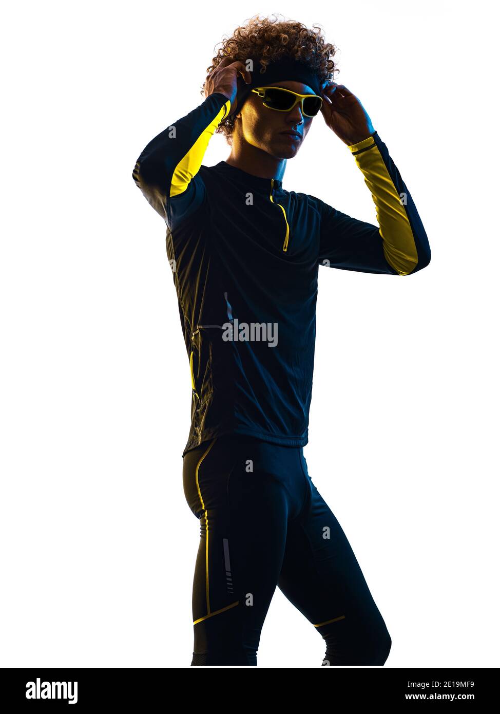 one youg caucasian runner jogger running jogging man in studio shadow ...