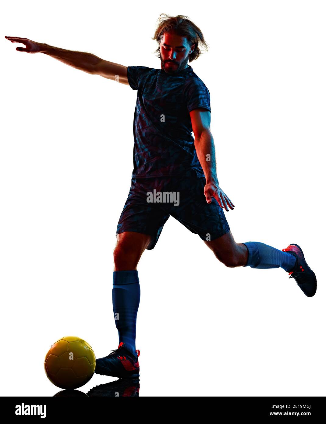 one young caucasian soccer player in studio silhouette shadow isolated ...