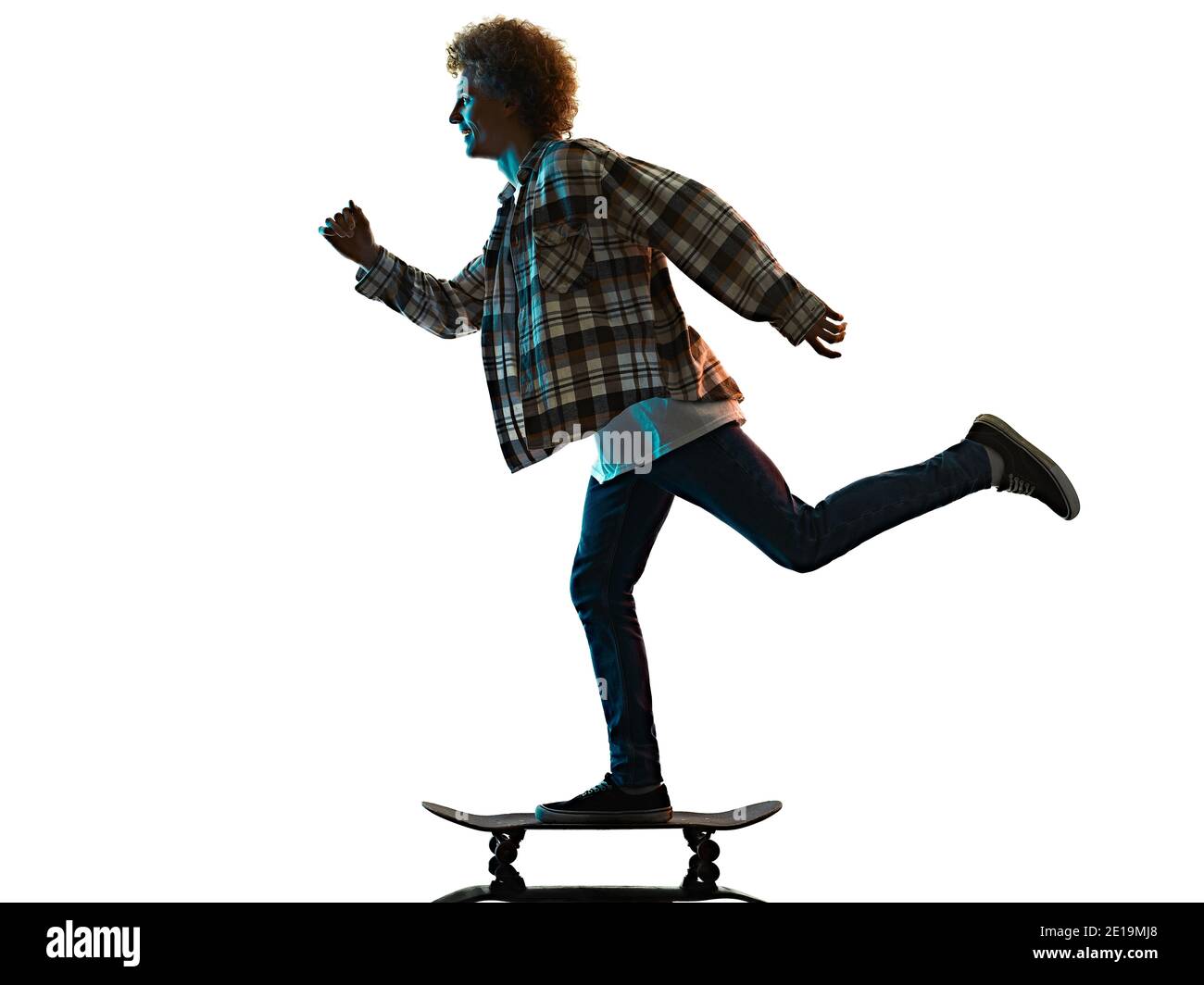 one caucasian young man skateboarder Skateboarding in studio silhouette ...