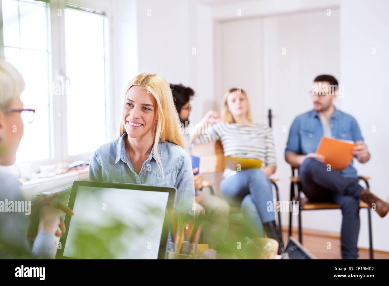 Beautiful charming smiling woman having the interview with entrepreneur ...