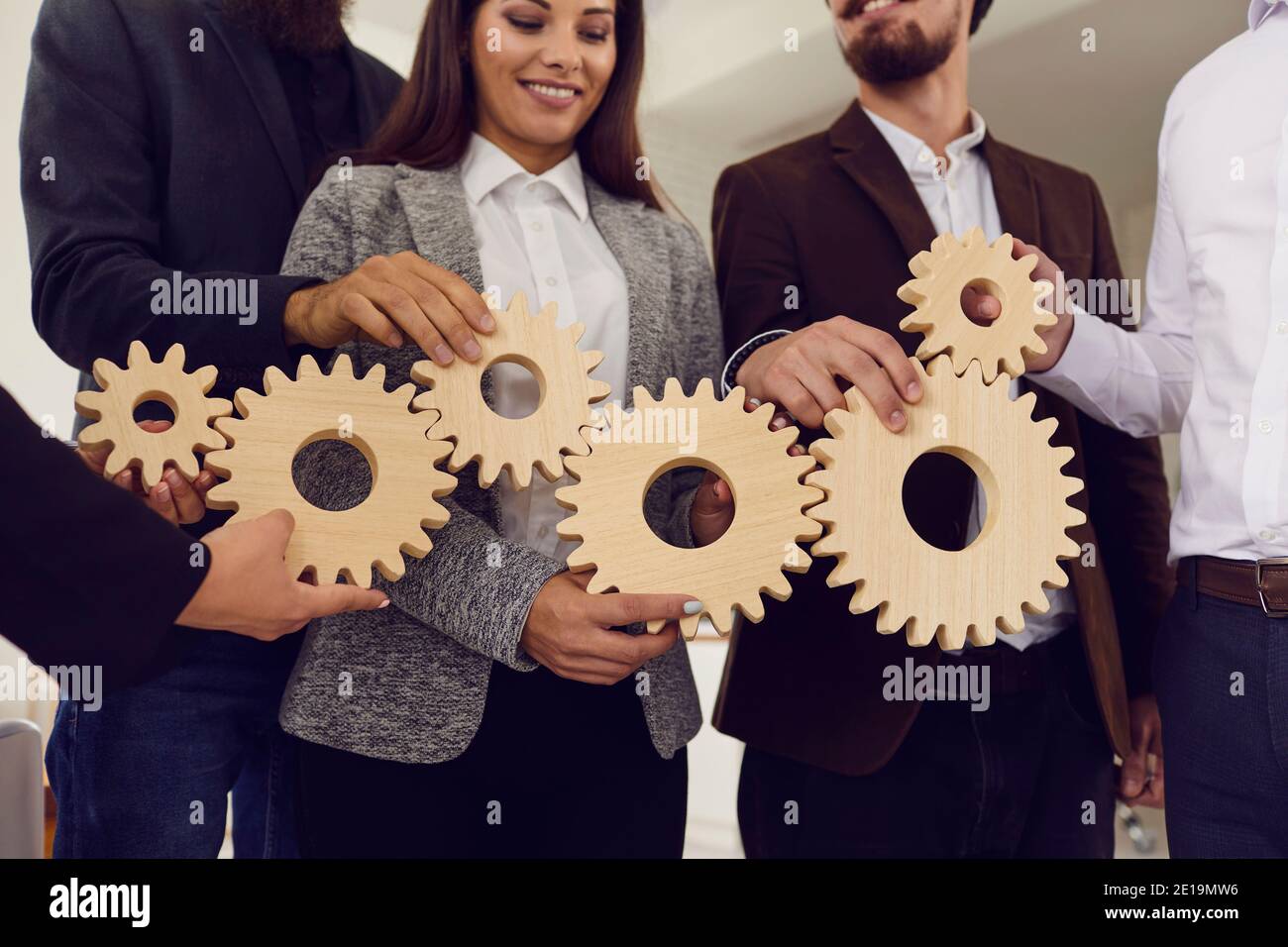 Teamwork collaboration unity corporate gear hi-res stock photography ...