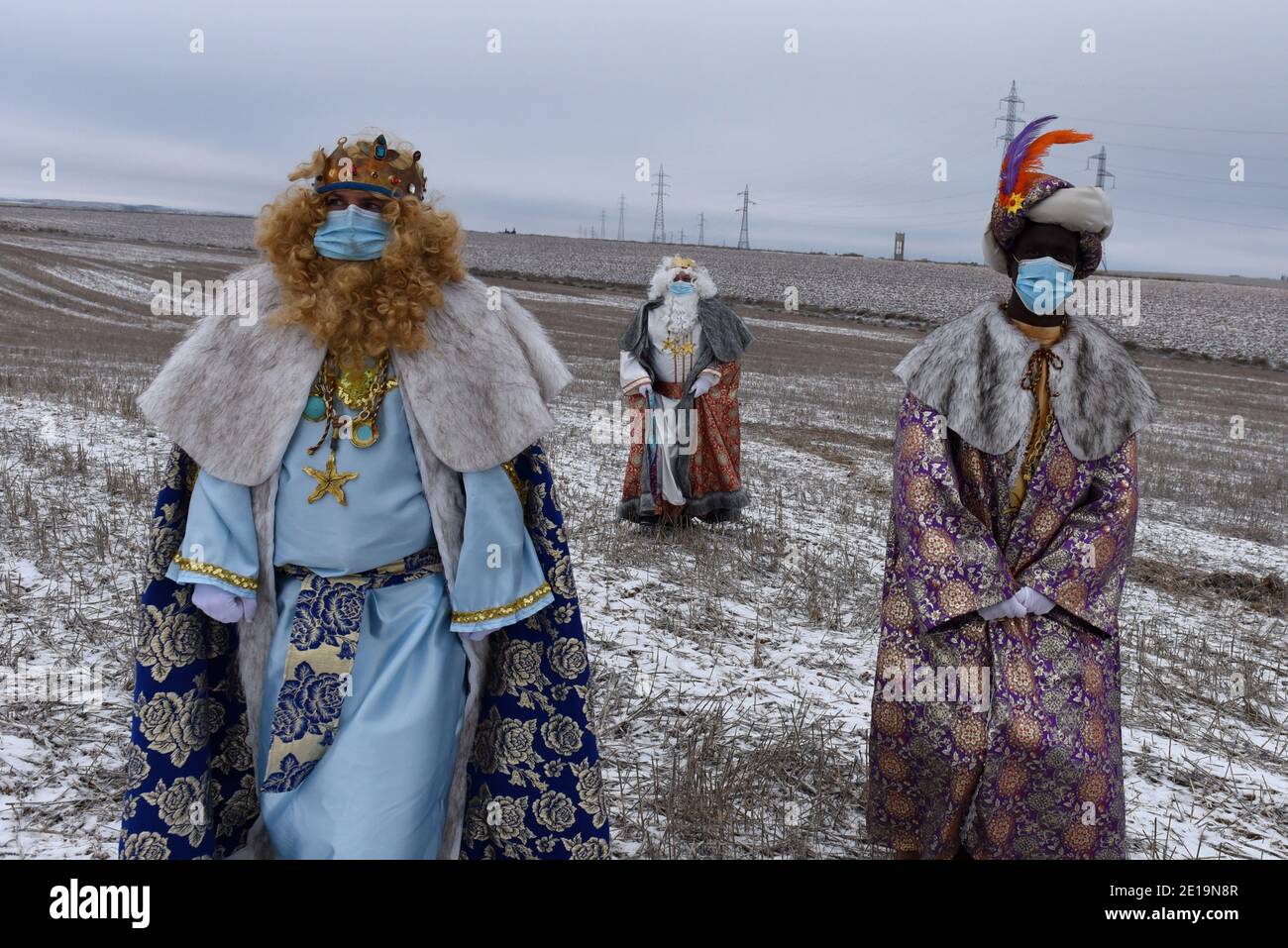 Performers wearing facemasks and dressed as Baltasar King, Gaspar King ...