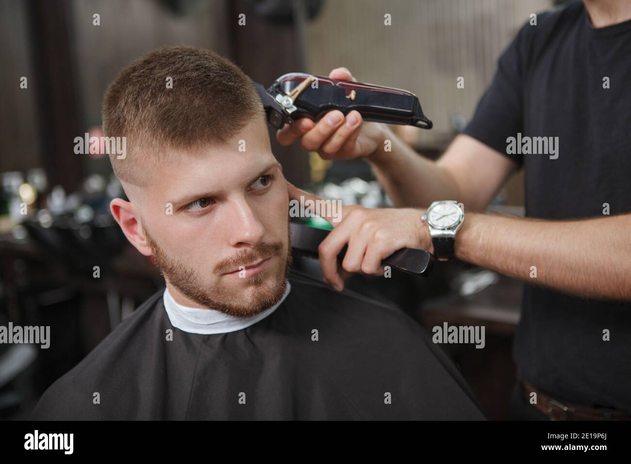 Handsome man getting new hairstyle hi-res stock photography and images ...
