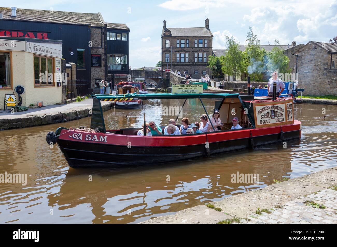 visitors setting off on a boat trip along the Springs Branch of the ...