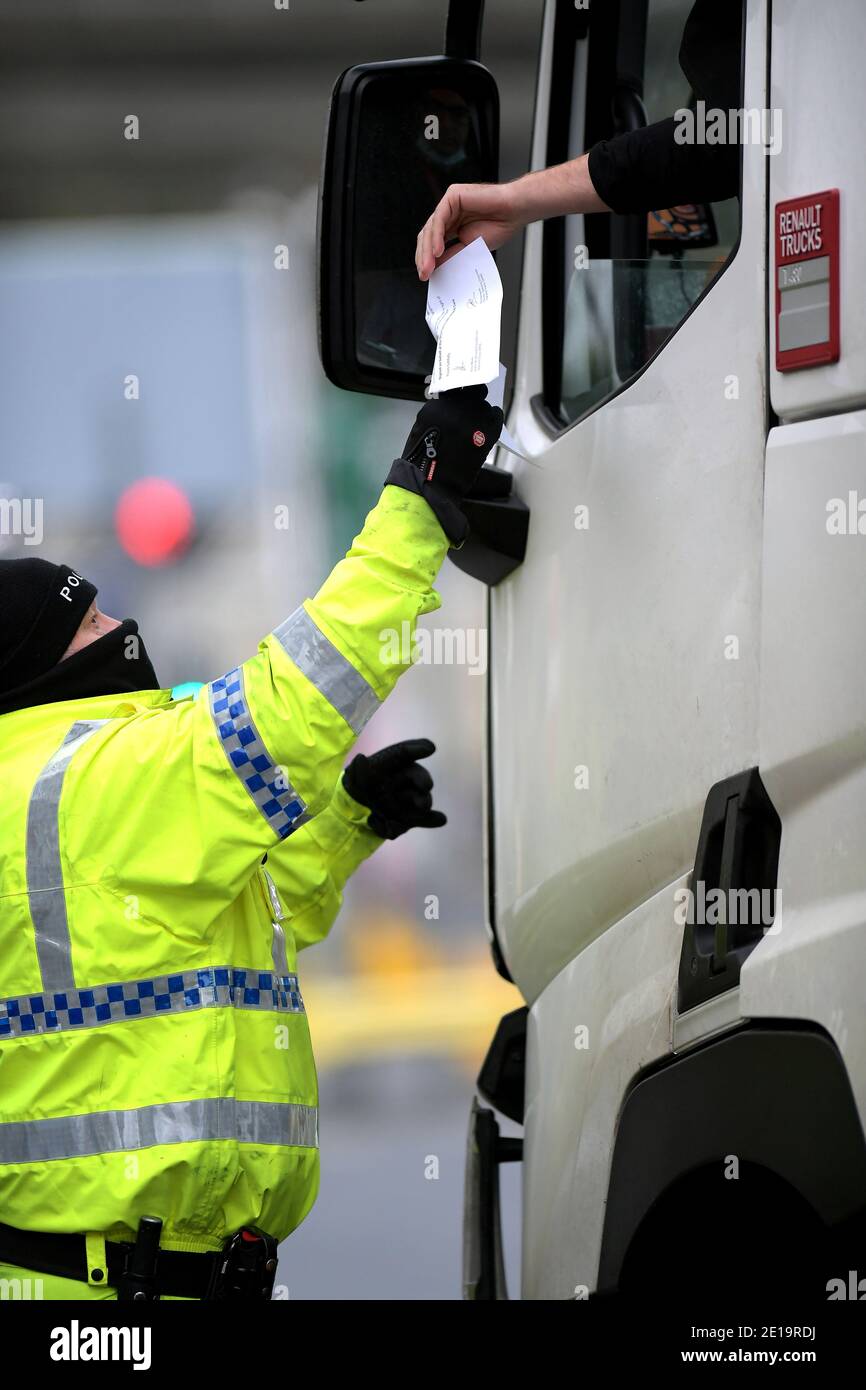 Police at the Port of Dover in Kent UK check drivers paperwork ...