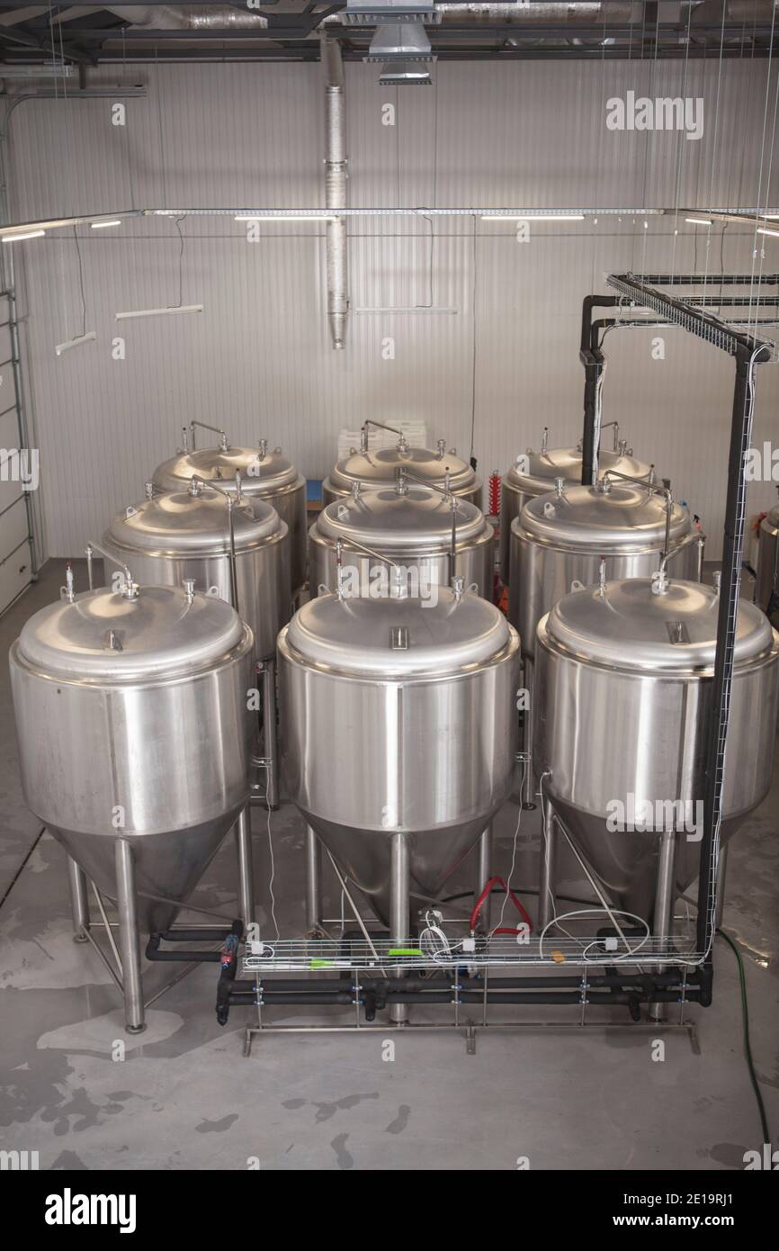 Vertical shot of beer tanks and beer production equipment at ...