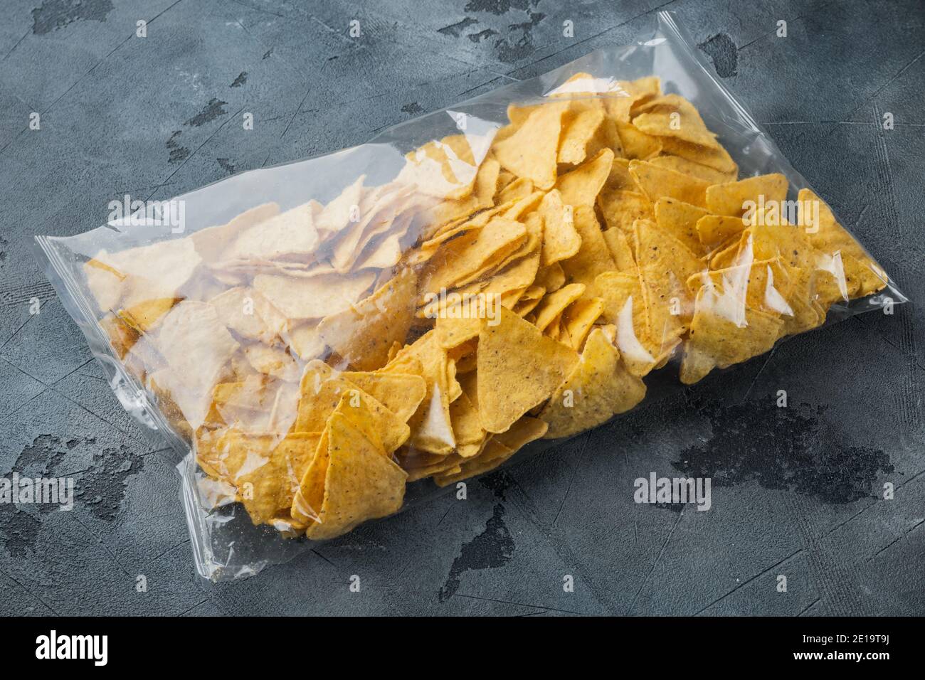 Nachos, triangle traditional Mexican corn appetizer pack, on gray ...