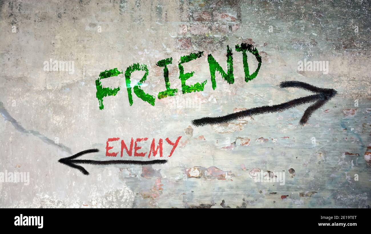 Street Sign the Direction Way to Friend versus Enemy Stock Photo - Alamy