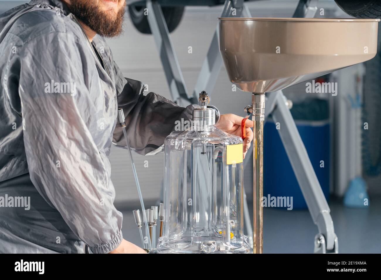 Replacing oil hi-res stock photography and images - Alamy