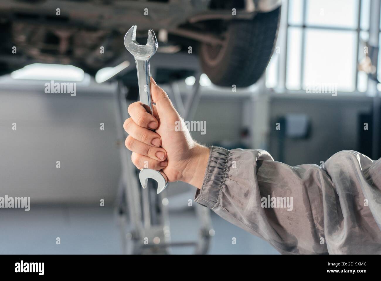 Car repair, maintenance and vehicle inspection concept. Man holding ...