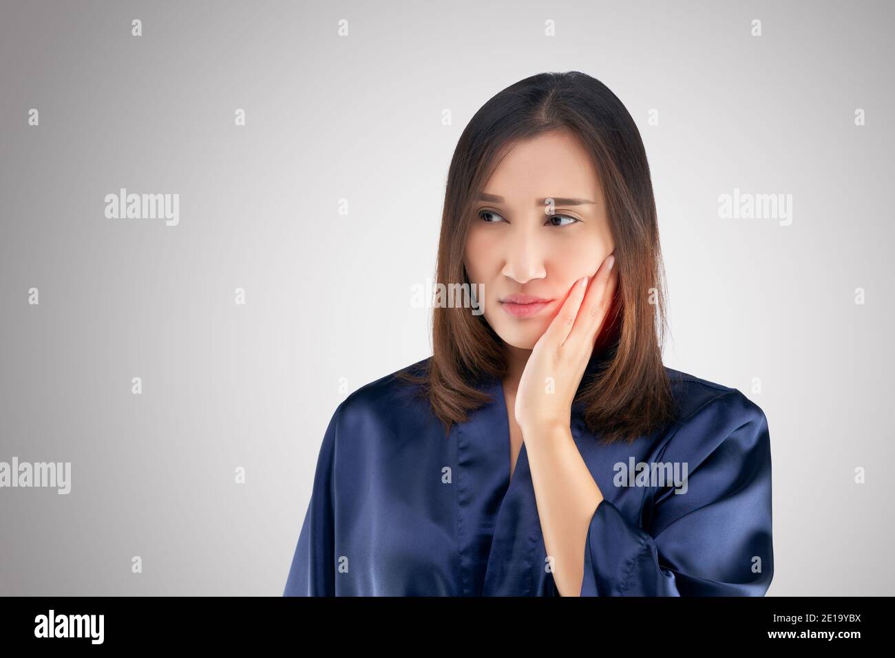 Suffering from toothache. Beautiful young woman suffering from ...