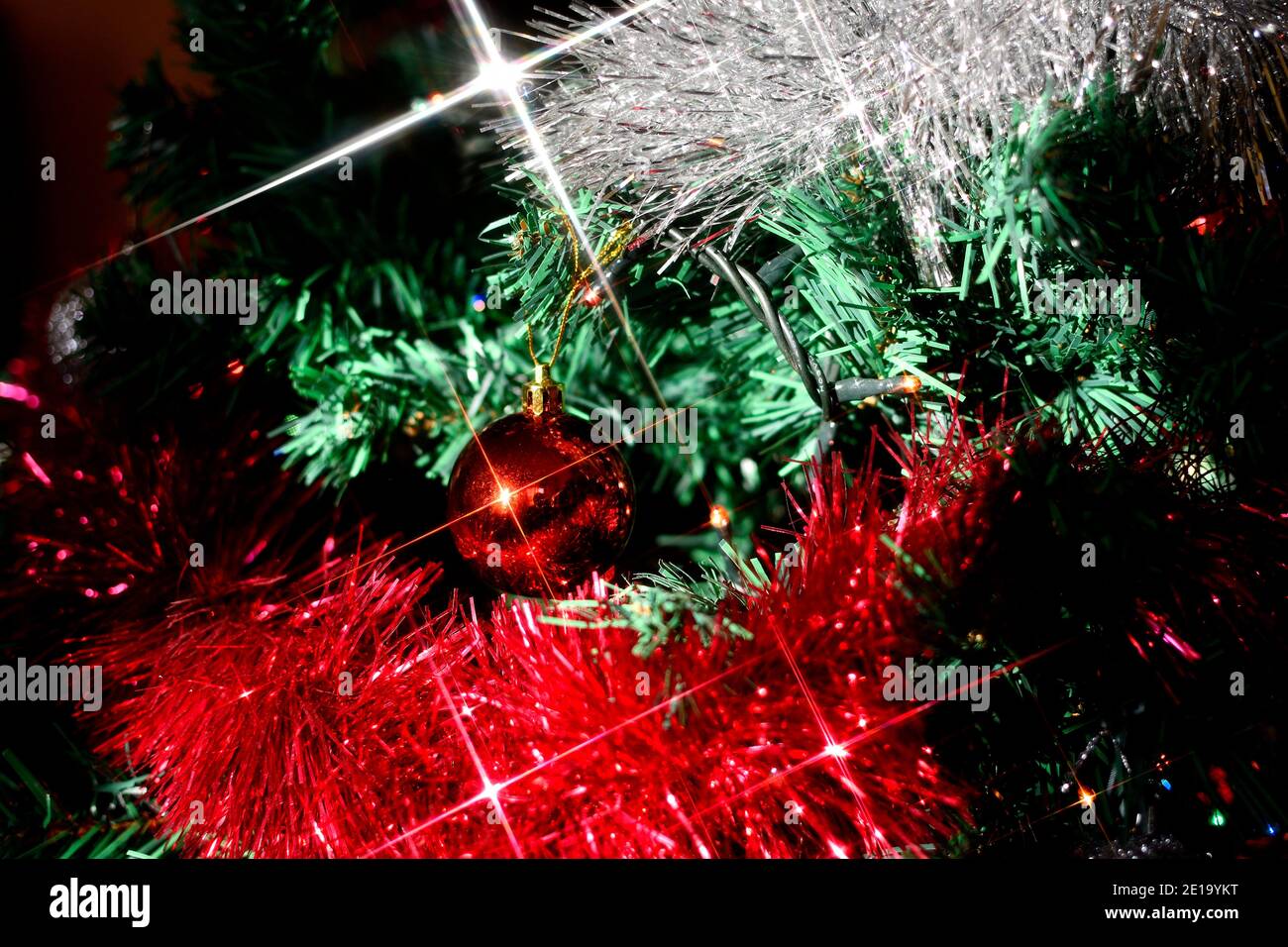 Christmas tree with red ball and lights Stock Photo - Alamy