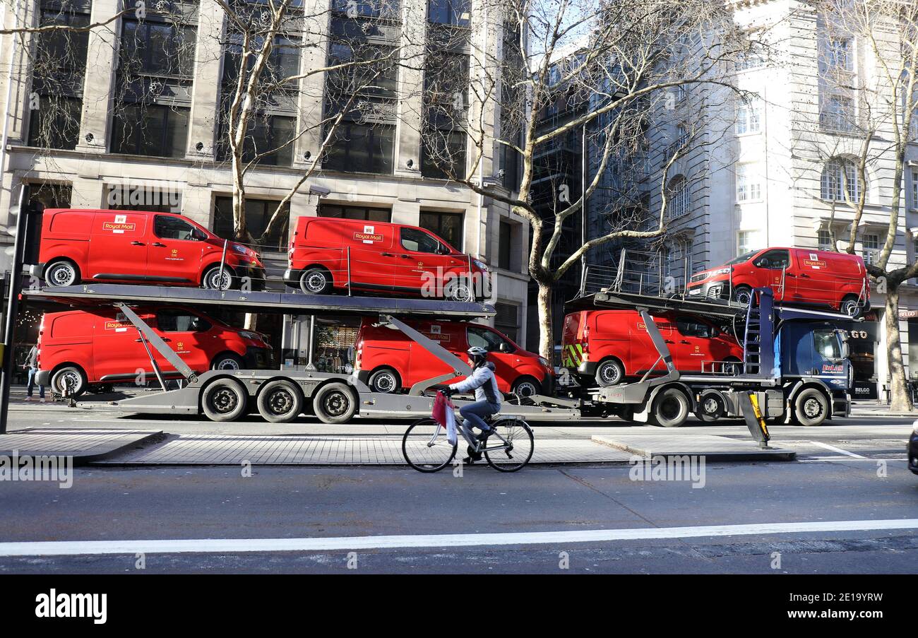Post Office delivery vans on the back of a trailer being delivered ...