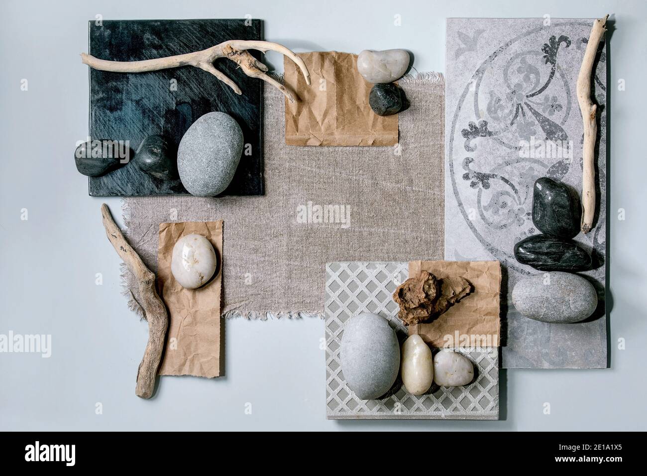 Creative layout squares with stones and branch Stock Photo - Alamy