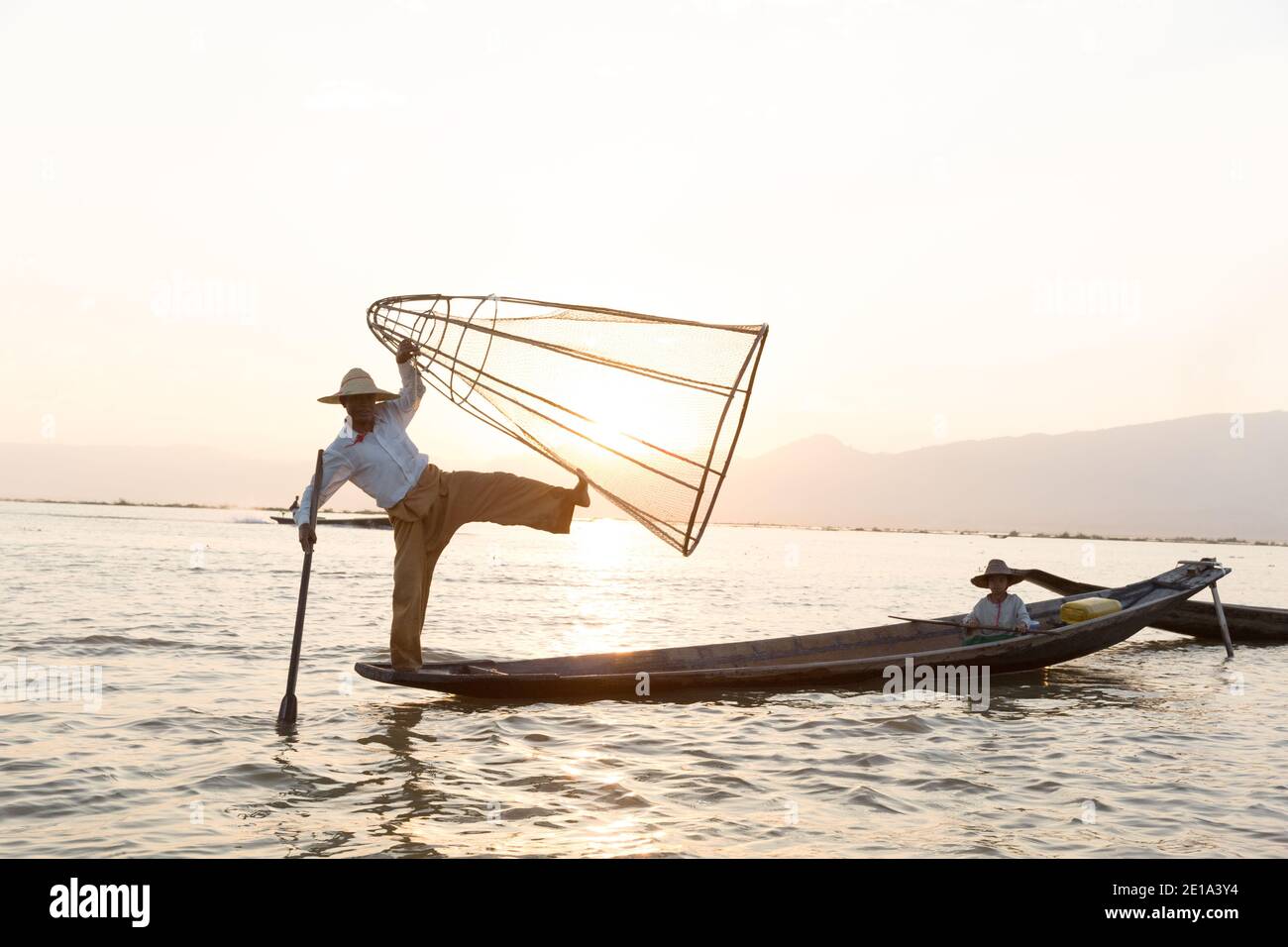Intha Fisherman with his wife on Inle Lake Stock Photo - Alamy