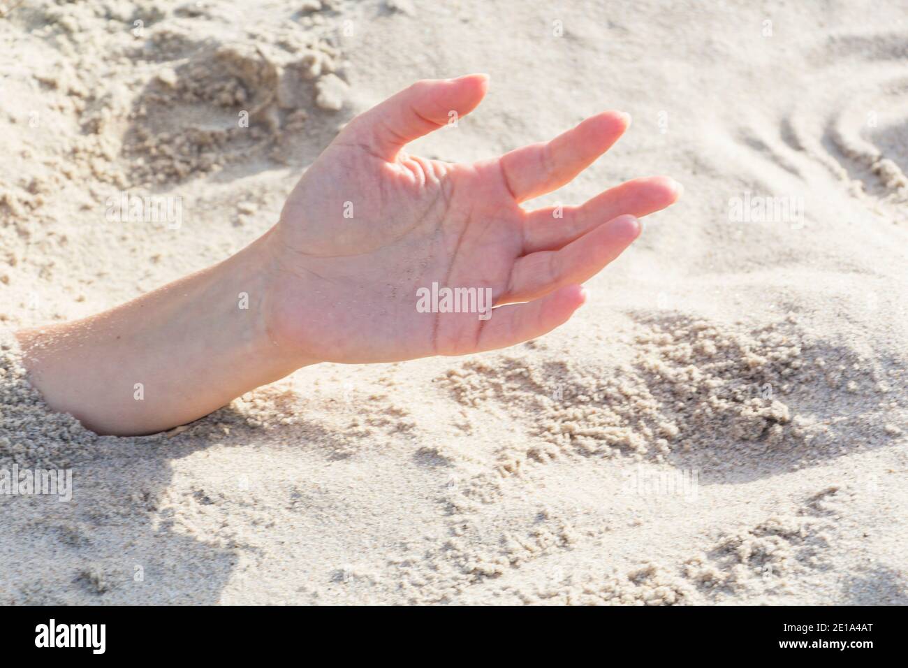 Hand closeup. Hands buried in sand on a beach Stock Photo - Alamy