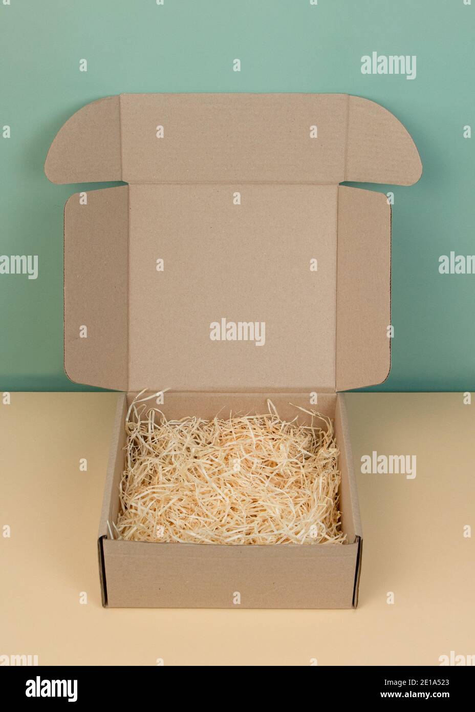 Stack of Brown cardboard boxes on mint background. Blank carton box ...
