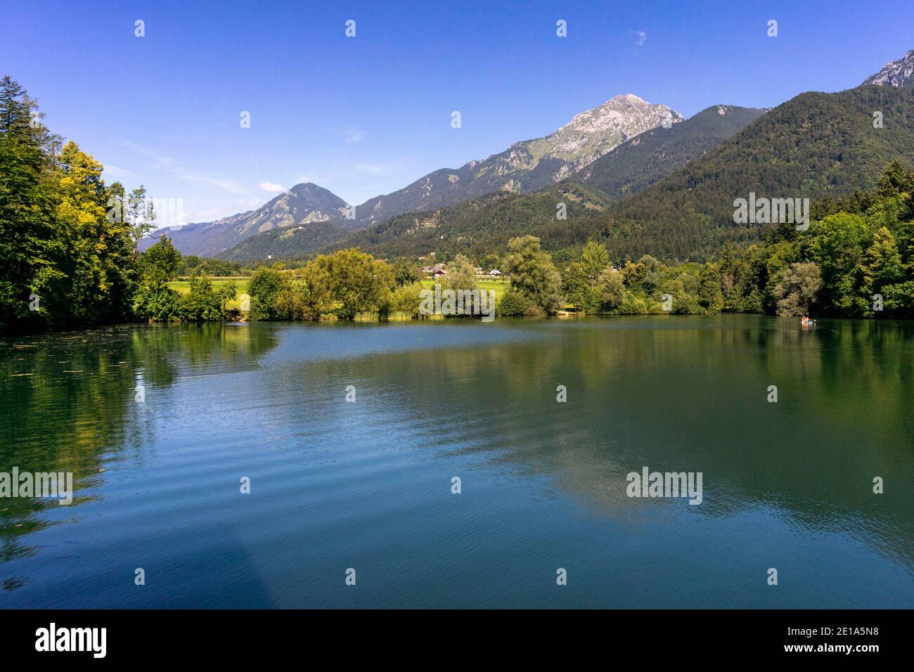Preddvor lake with Alps in the background Stock Photo - Alamy