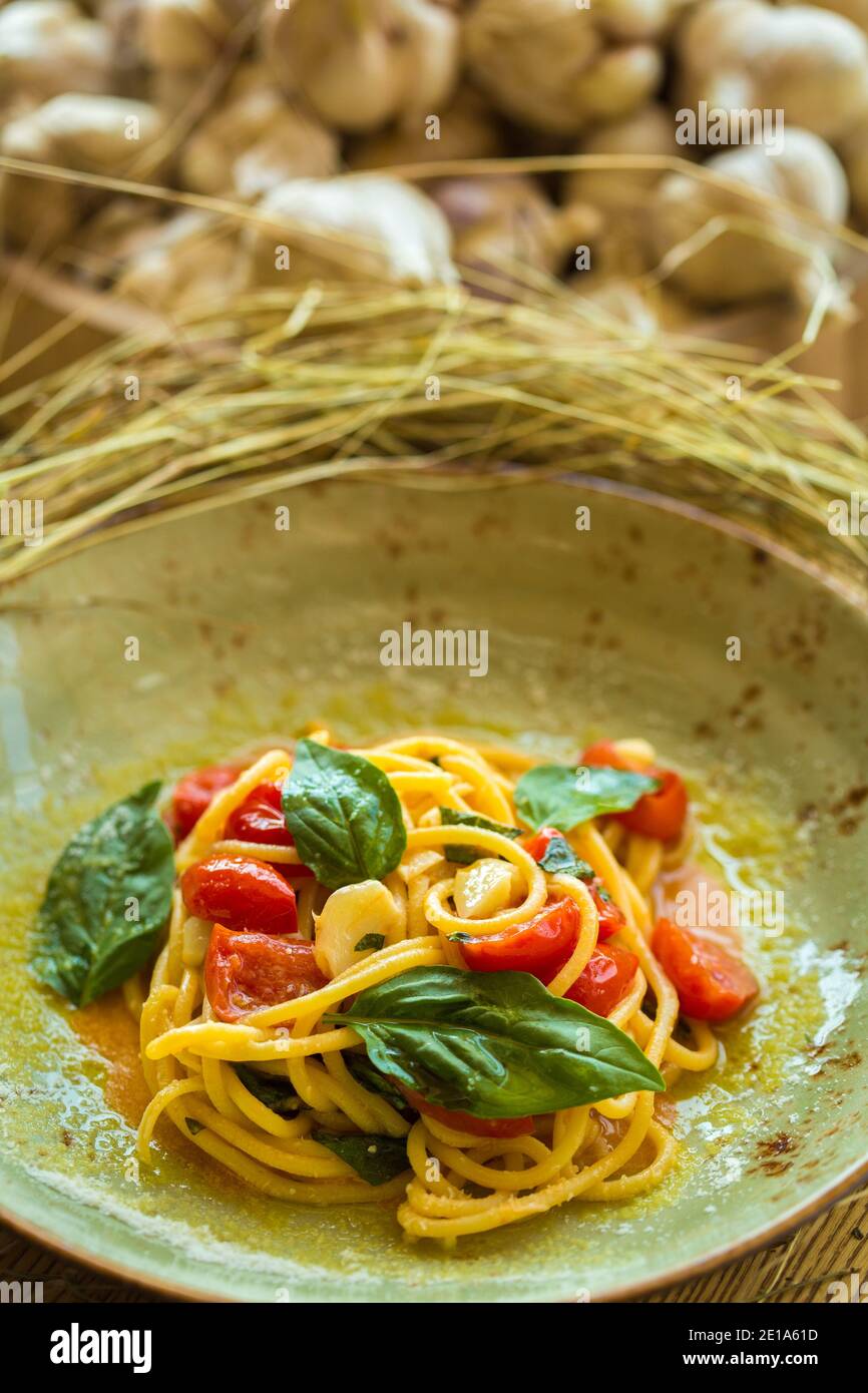 Homemade pasta with Basil and tomatoes Stock Photo - Alamy