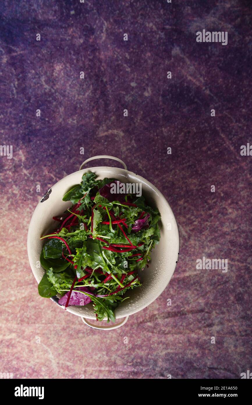 Old colander containing an assortment of salad leaves Stock Photo - Alamy