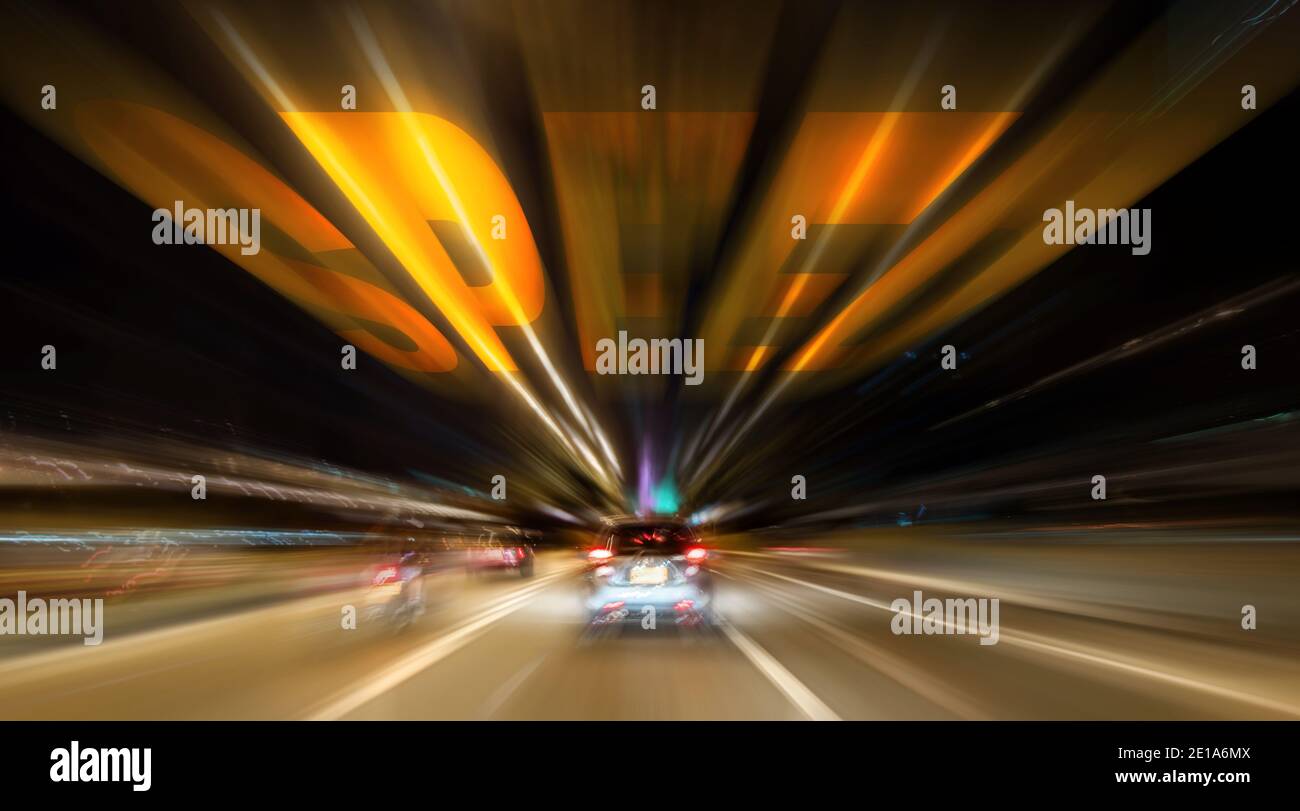 Light streaks drawn due to the movement at a great speed on the road by ...